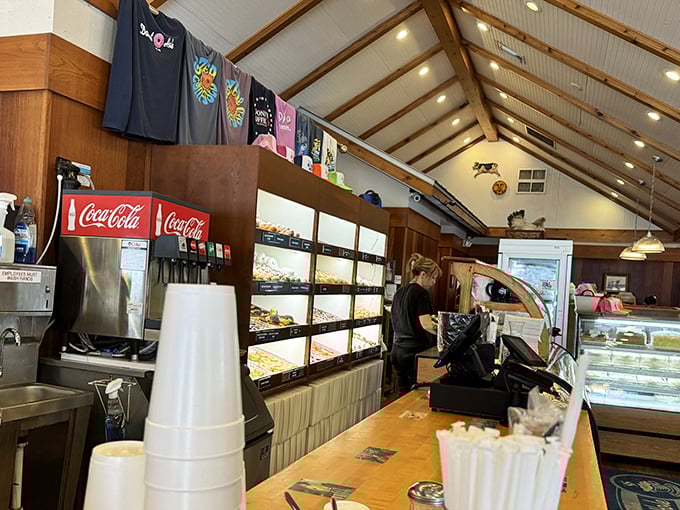 Behind this counter, breakfast magic happens beneath wooden beams and pendant lights that cast a golden glow on morning rituals.
