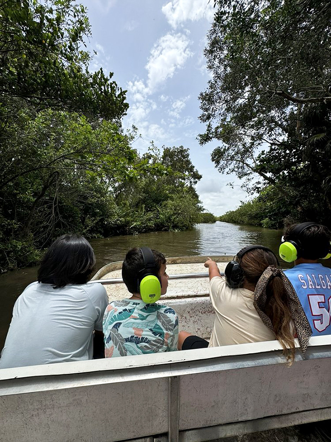Adventure awaits as visitors glide through mangrove tunnels. The real Florida experience happens at water level, just inches above curious reptiles.