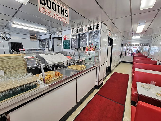 The red vinyl booths and gleaming counters aren't retro by design—they're authentic by survival. This isn't manufactured nostalgia; it's the real deal.