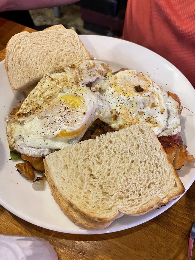 Two sunny-side up eggs stand guard over a fortress of breakfast potatoes, ready to turn your morning frown upside down.