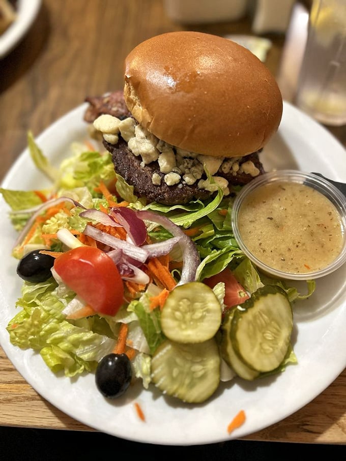 A burger that doesn't need gimmicks, just quality ingredients and proper execution. That side salad isn't an afterthought—it's balance in burger form.