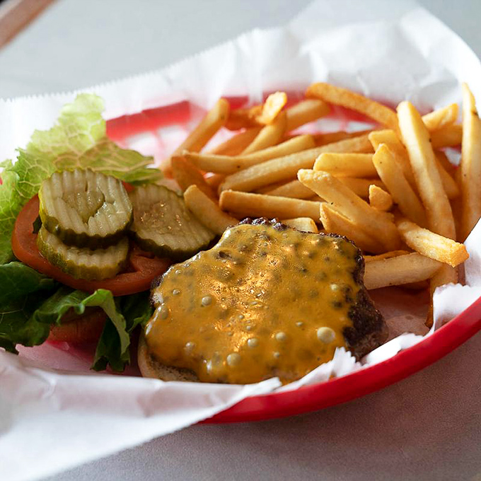 The cheeseburger—humanity's greatest invention after fire and the wheel. This beauty comes with a side of nostalgia and zero regrets.