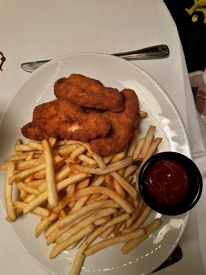 Crispy chicken tenders and golden fries—proof that even the simplest dishes receive star treatment in this kitchen.