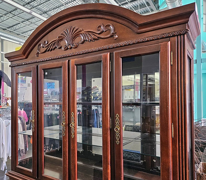 This stately china cabinet isn't just furniture—it's architectural ambition for your dining room, ready to showcase your grandmother's teacups.