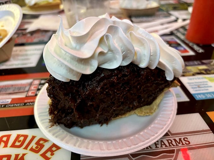 Chocolate cream pie with a whipped cream crown fit for royalty. Dessert democracy at its finest – everyone gets to feel like a king.