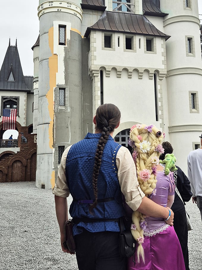 Renaissance fashion in full bloom! Festival attendees in period-perfect attire add living color to Castle Gwynn's stone façade during the annual Tennessee Renaissance Festival.