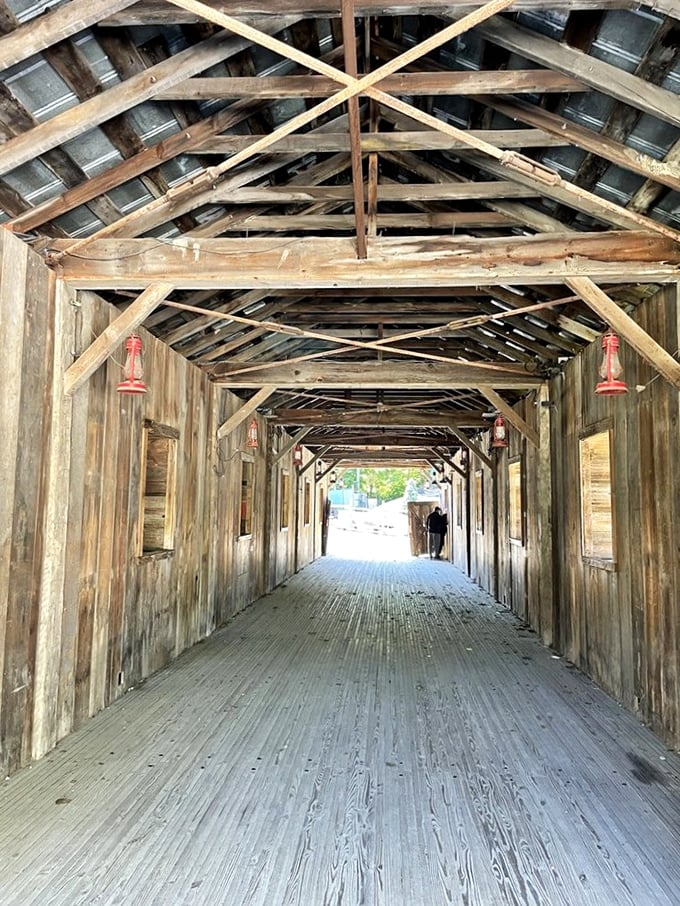 Inside the covered bridge, wooden beams create a cathedral-like passage that's transported visitors across water and time for generations.