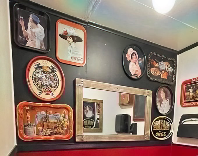Vintage Coca-Cola trays and nostalgic advertisements create a museum of Americana where your only admission fee is ordering something delicious.