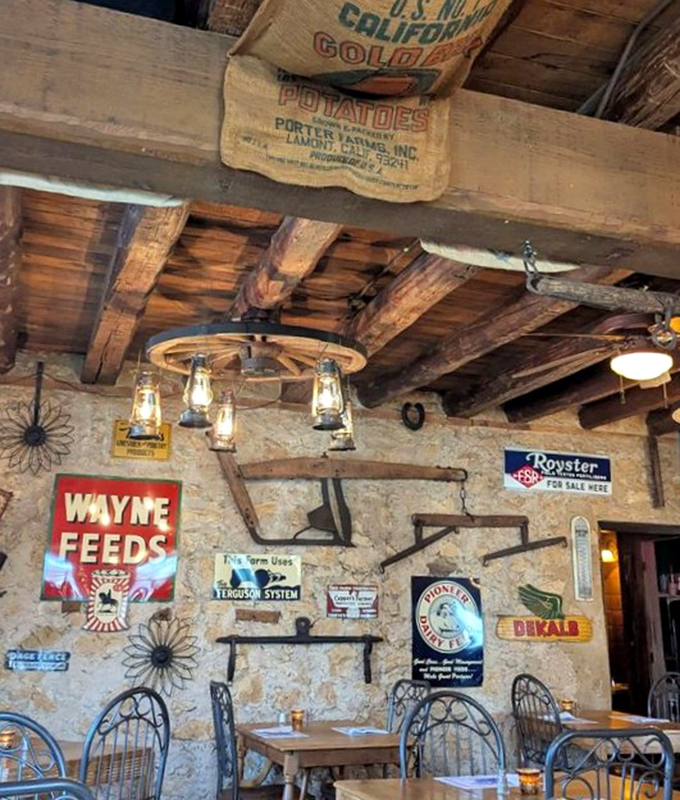Look up and discover history hanging from the rafters—vintage potato sacks and farm implements that have found their forever home.