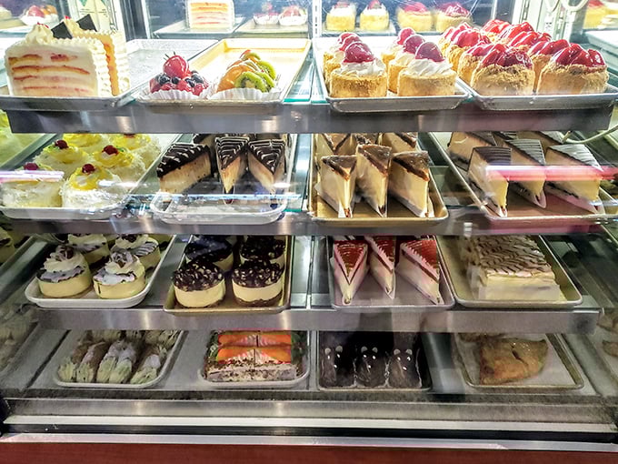The dessert case – where willpower goes to die and "I'll just have a bite" becomes the lie you tell yourself.