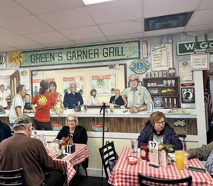 The mural on the wall tells the story—this isn't just a restaurant; it's a community gathering place where breakfast and belonging go hand in hand.