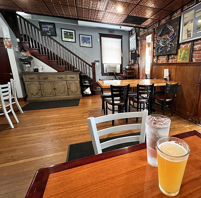 Wooden beams, copper ceiling, and cold beer—the perfect backdrop for seafood feasting. That staircase probably leads to some secret crab paradise.