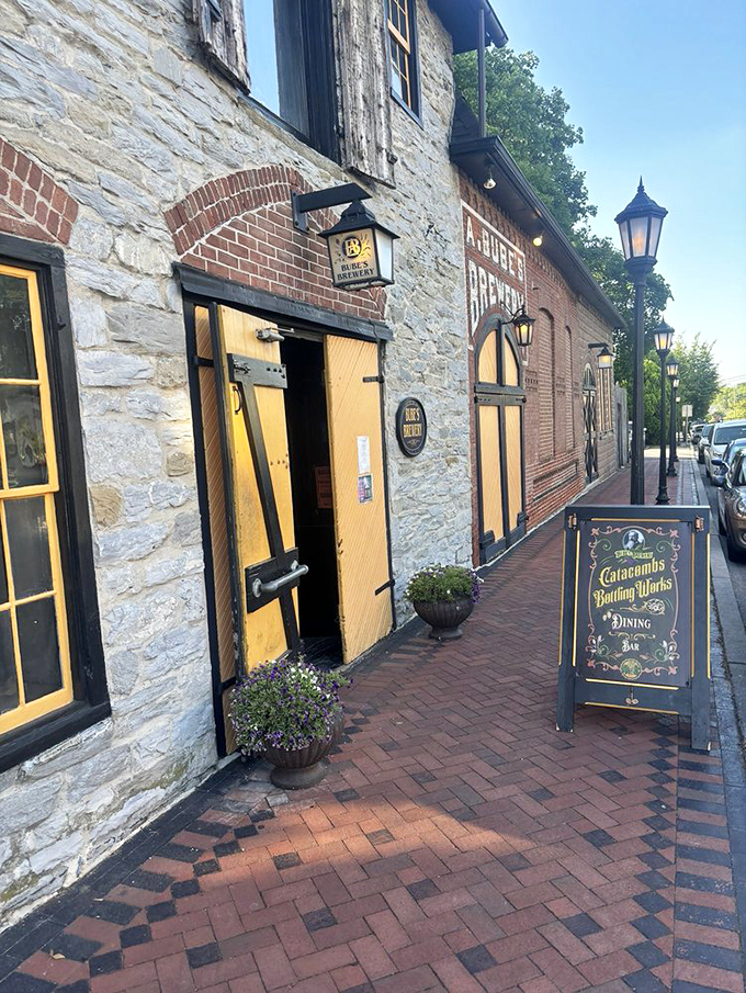 The entrance beckons with historic charm—yellow doors against weathered stone promising experiences you won't find at your neighborhood chain restaurant.