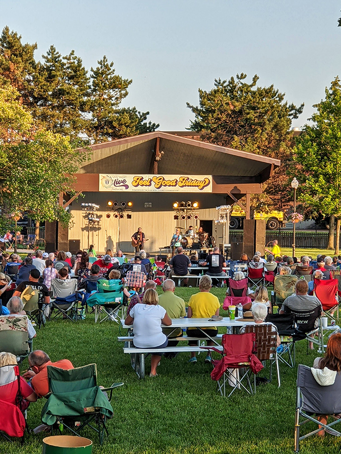 "Feel Good Friday" indeed – nothing says "community" like lawn chairs, live music, and the unspoken agreement that no one judges your dancing style.