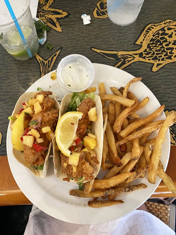 Fish tacos that make you wonder why you'd ever eat anything else – crispy, fresh, and topped with tropical fruit salsa.
