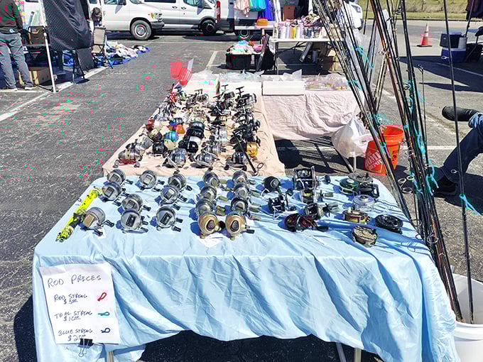Angler's paradise spread across blue tablecloths. These reels have stories of "the one that got away" embedded in their mechanisms.