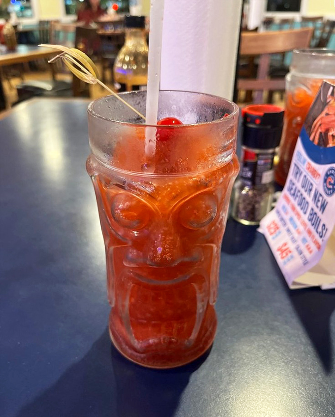 This tiki glass doesn't just hold a frozen daiquiri – it contains vacation vibes and the promise of forgetting Monday exists.