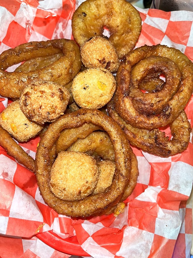 Hush puppies and onion rings fried to golden perfection—the supporting actors that sometimes steal the show from the seafood stars.