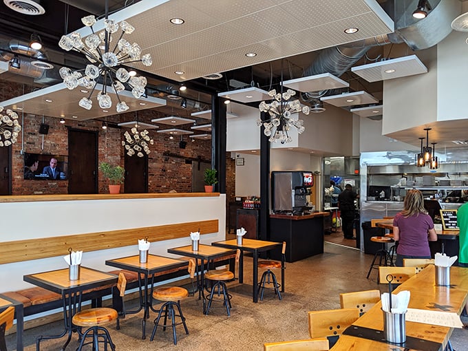 The dining room's modern industrial design creates the perfect backdrop for serious barbecue and legendary cornbread conversations.