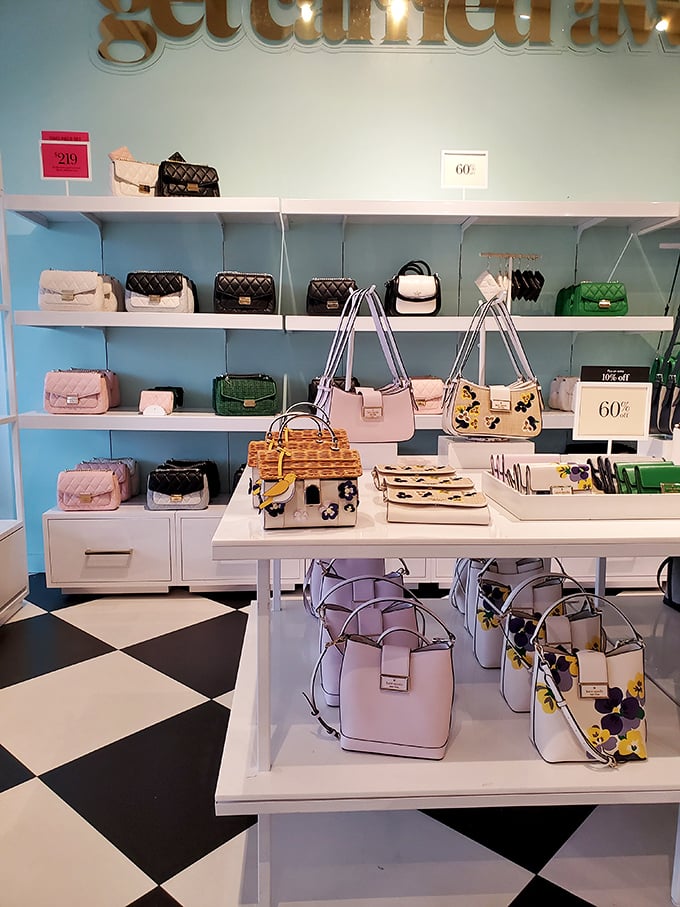 Kate Spade's cheerful display of handbags proves luxury can be attainable. The black and white checkered floor adds a touch of sophistication to the bargain hunt.