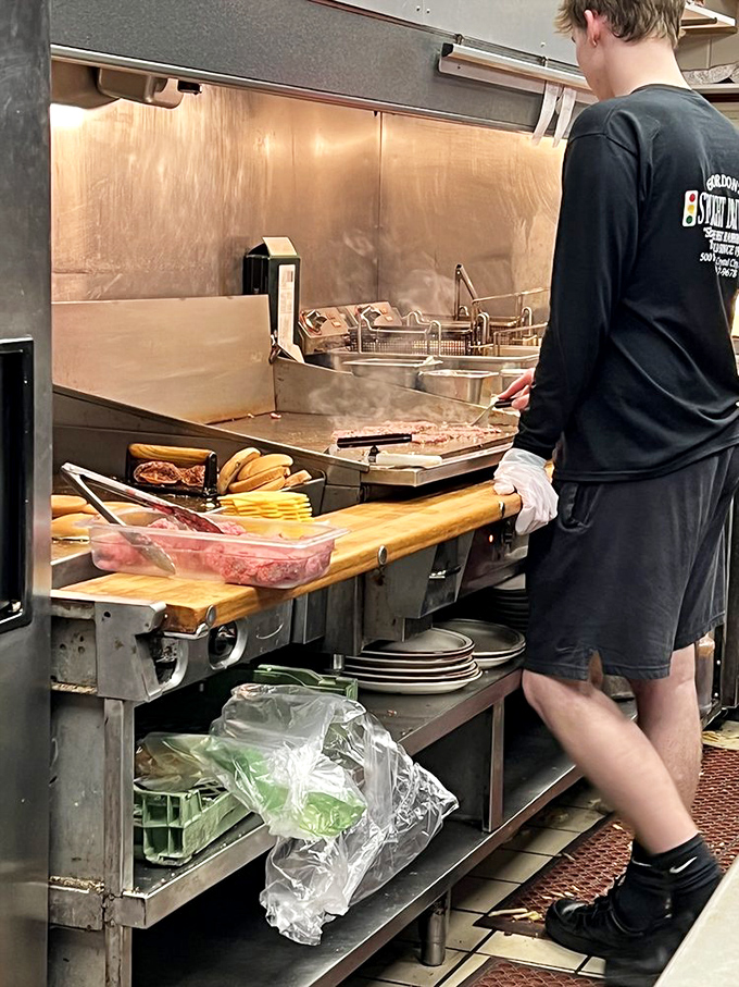 Behind the scenes, where burger alchemy transforms simple ingredients into roadside gold that keeps cars pulling over.