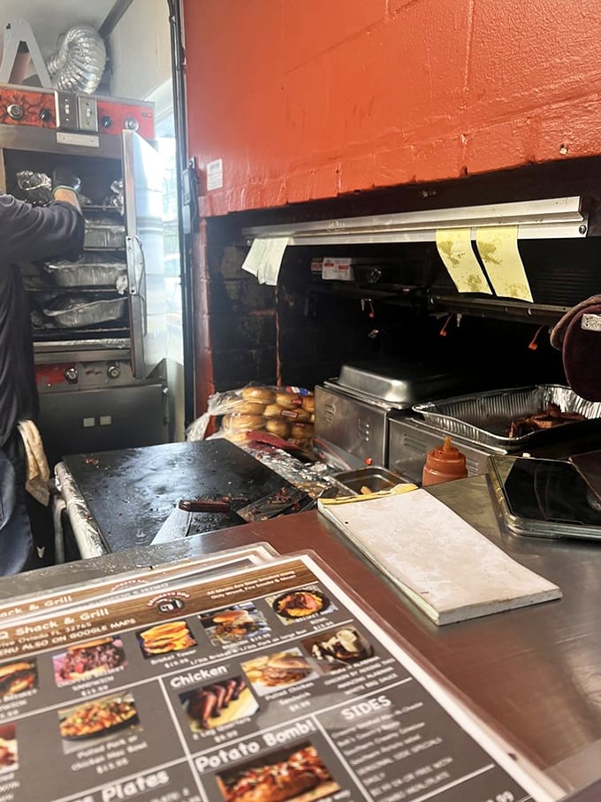Where the magic happens—a glimpse into the compact kitchen that produces outsized flavors. That well-seasoned cooking surface has stories to tell.