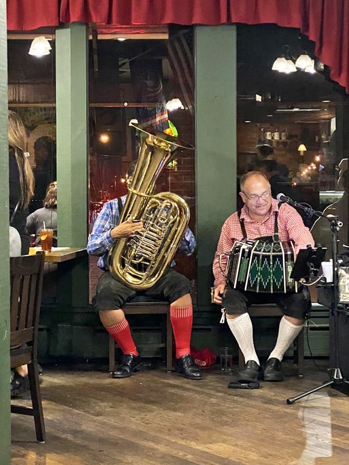 Musicians in traditional German attire bring authentic oompah vibes to dinner service—proving that live music makes everything taste better, especially sauerkraut.