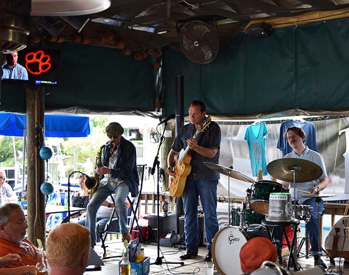 Live music adds the perfect soundtrack to fresh seafood and cold drinks. These aren't tourist performers—they're the authentic sound of Florida's Gulf Coast.