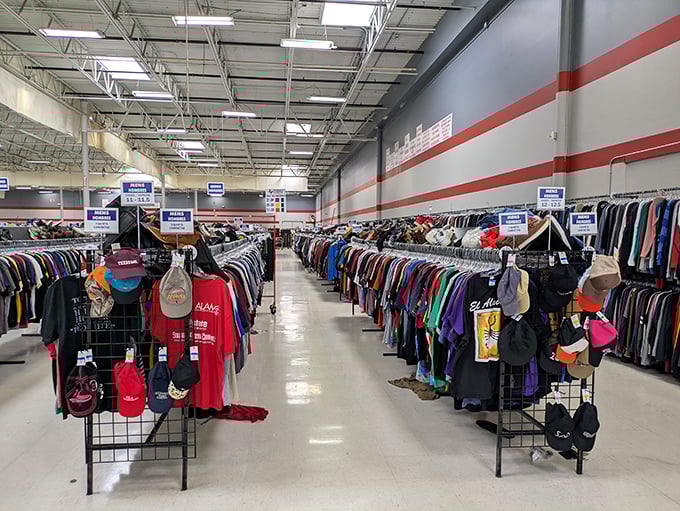 The men's department, where vintage tees and barely-worn button-ups create a fashion timeline spanning decades. Those baseball caps tell stories.