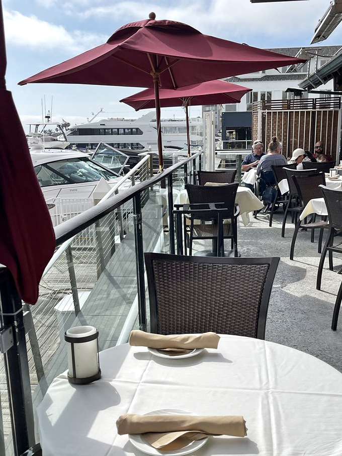 Red umbrellas, white tablecloths, and blue harbor views—the most delicious patriotic display you'll ever experience.