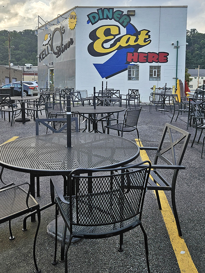 Outdoor seating with a side of diner charm – the "DINER EAT HERE" mural practically dares you to walk past without stopping.