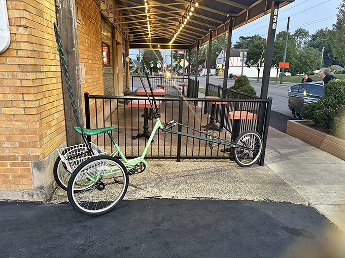 Even the outdoor space keeps it real—string lights, a simple patio, and a neighborhood tricycle that's clearly a regular.