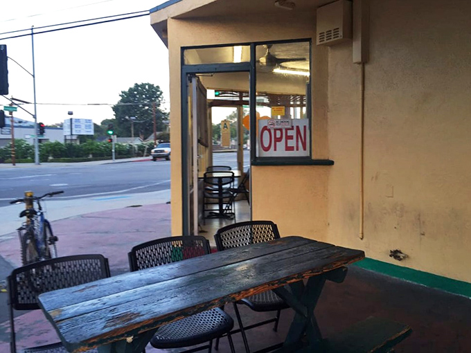 The outdoor seating area—where morning sunshine, people-watching, and breakfast burritos combine to create the perfect California morning trifecta.
