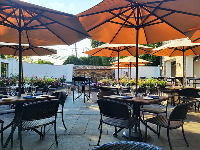 The outdoor patio—where Pennsylvania summer days reach their full potential. Those orange umbrellas provide shade with a side of cheerfulness.