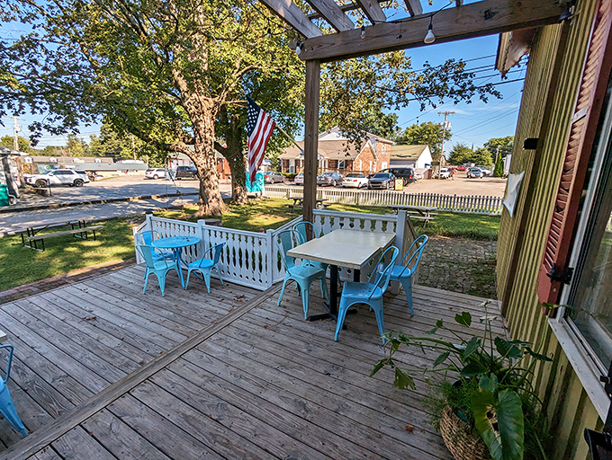 The outdoor deck with its turquoise chairs isn't just seating—it's therapy with a side of fresh air and sunshine.