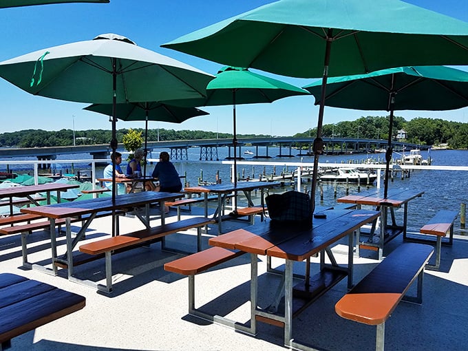 Picnic tables with a million-dollar view—Mike's outdoor seating transforms ordinary Tuesday lunches into mini-vacations by the South River.