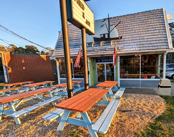 Blue picnic tables under autumn skies—where seafood tastes better and conversations flow like sweet tea.