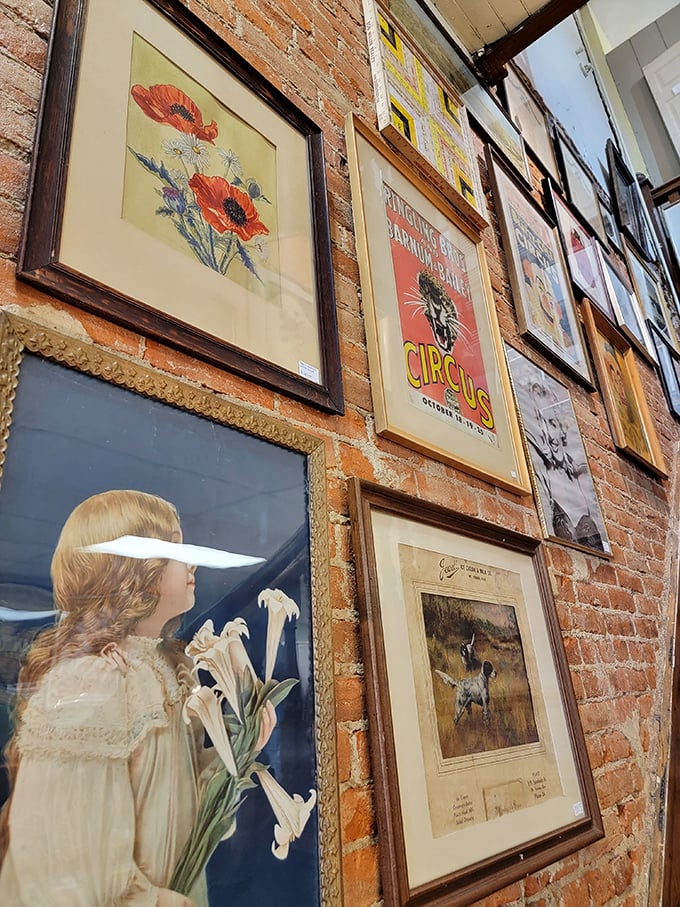 Art that spans generations hangs on exposed brick walls, from delicate florals to vintage circus posters that demand attention.