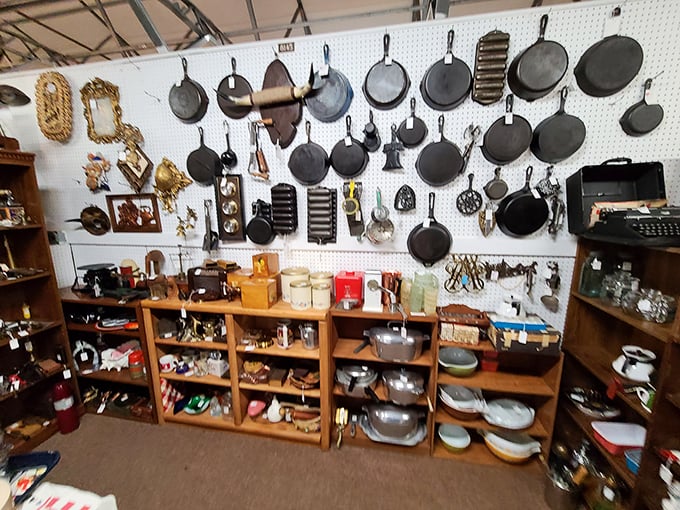 Cast iron paradise! This wall of seasoned cookware has fried more eggs and flipped more pancakes than all of Ohio's diners combined.