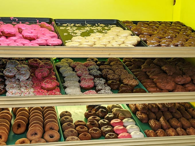 The pastry case displays more temptation than a Vegas buffet, each item handcrafted daily.