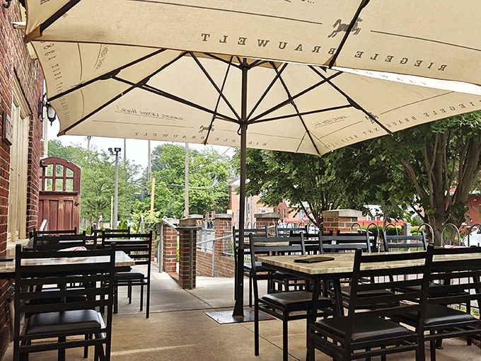 The outdoor patio offers a peaceful retreat under cream-colored umbrellas—perfect for sipping pilsners while watching the world of German Village go by.