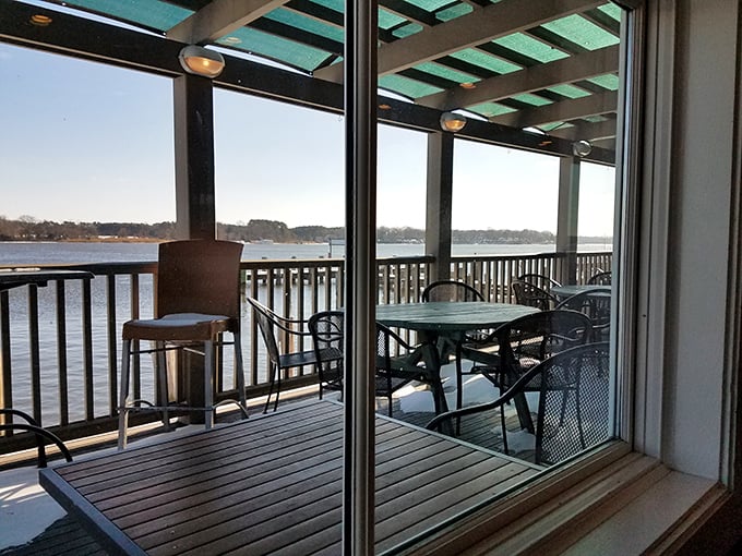 The outdoor deck—where time slows down, conversations flow easier, and somehow seafood tastes even better with a river breeze.