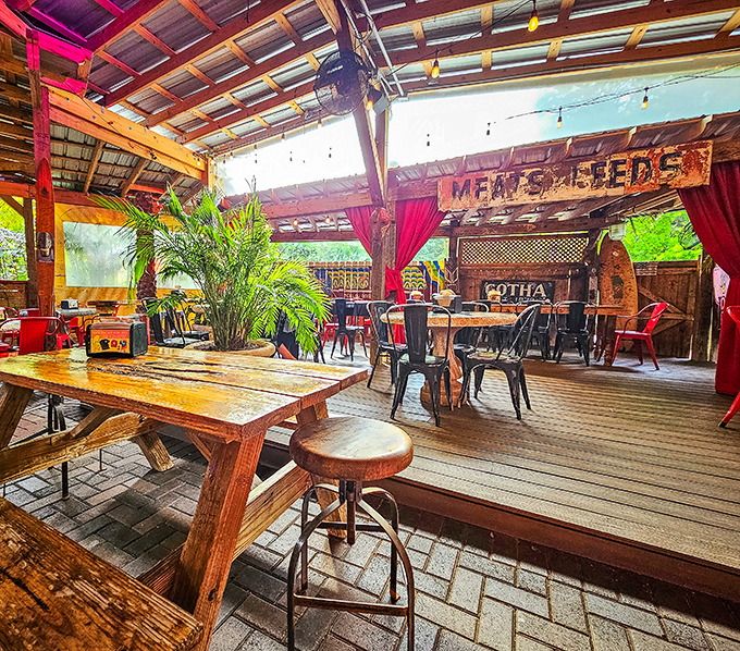 The outdoor patio where string lights, wooden beams, and tropical plants conspire to make Tuesday lunch feel like Saturday night.