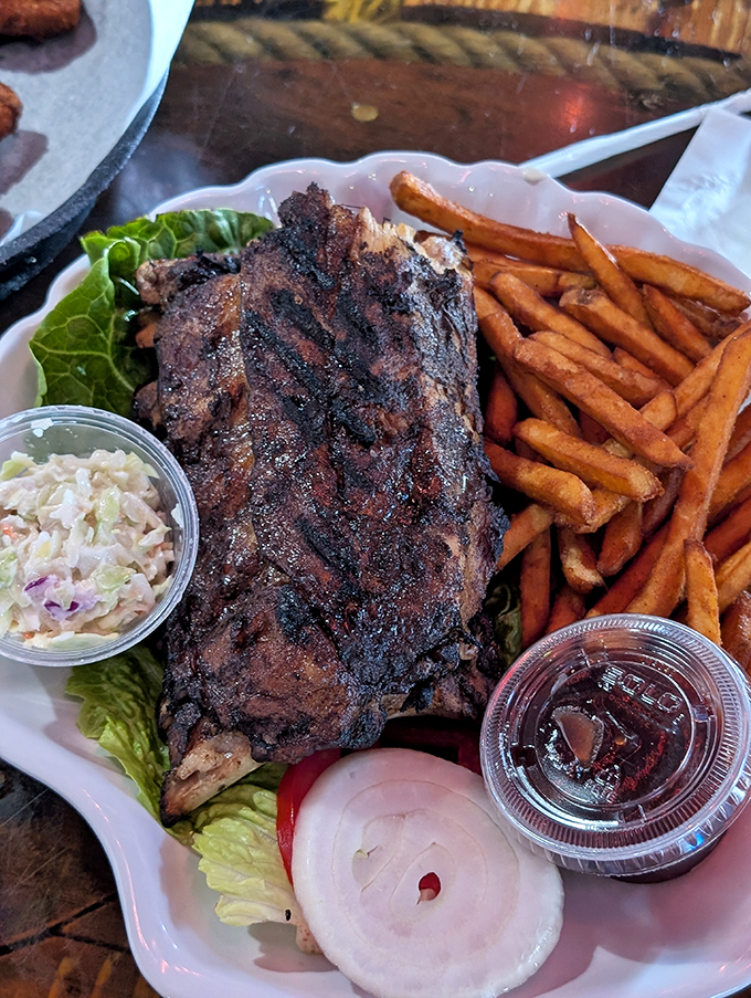 Ribs so tender they practically leap off the bone. Served with slaw that cuts through the richness like a cool breeze on a hot Florida day.