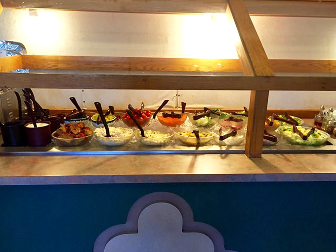 The salad bar lineup—nature's candy store for adults who occasionally remember they should eat something green between pancake sessions.