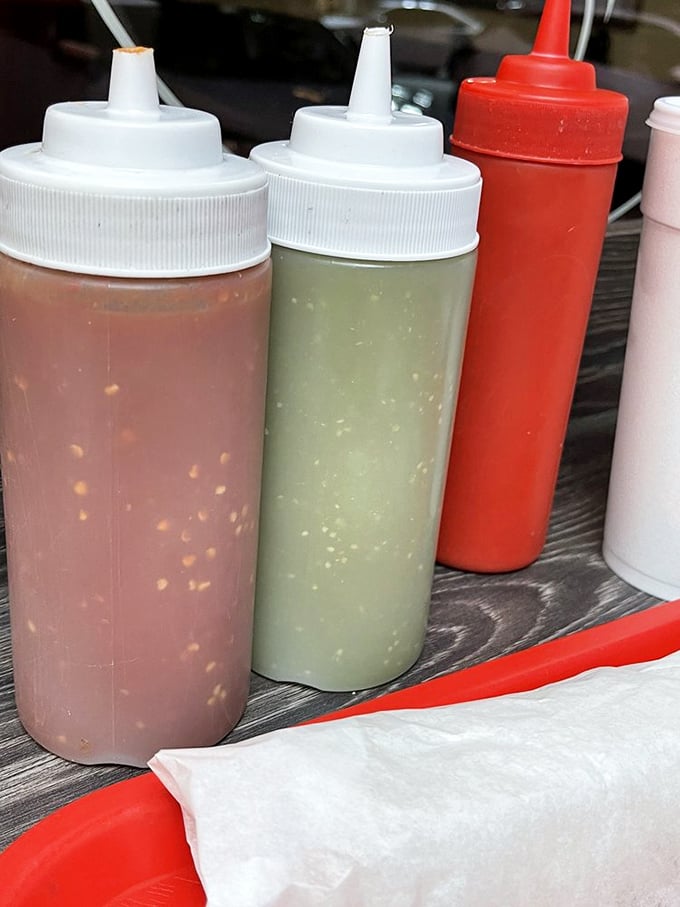 The sauce squadron—ready for deployment. These squeeze bottles contain liquid gold that transforms good food into "where have you been all my life" food.