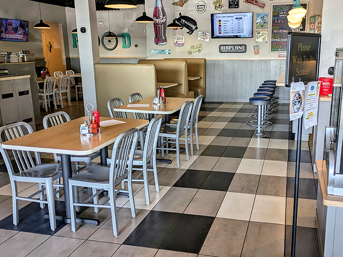 The black and white checkered floor provides the perfect runway for comfort food to make its grand entrance to waiting tables.