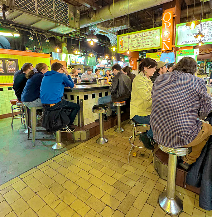 Counter culture at its finest—where strangers become temporary breakfast companions and nobody minds the wait because they know what's coming is worth it.