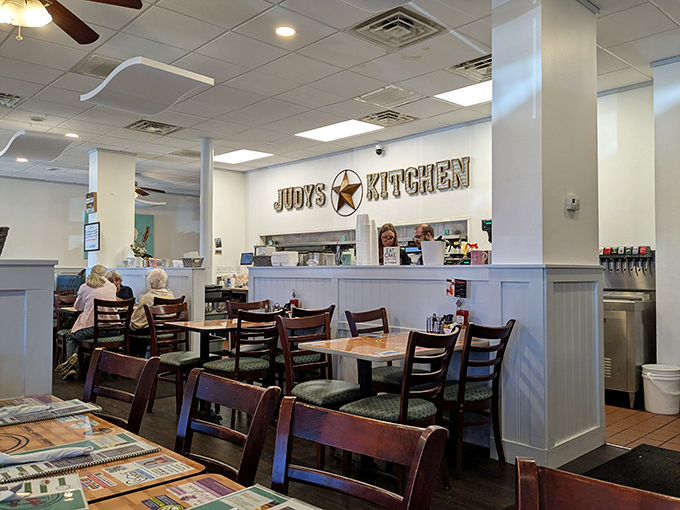 The "Judy's Kitchen" sign watches over diners like a friendly reminder that you're not just in a restaurant—you're in someone's culinary home.