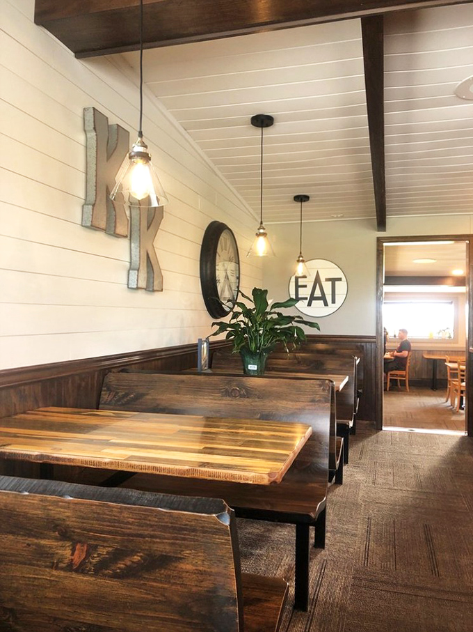 Booths that invite you to settle in and stay awhile. That "EAT" sign isn't just decoration—it's the best advice you'll get all day.
